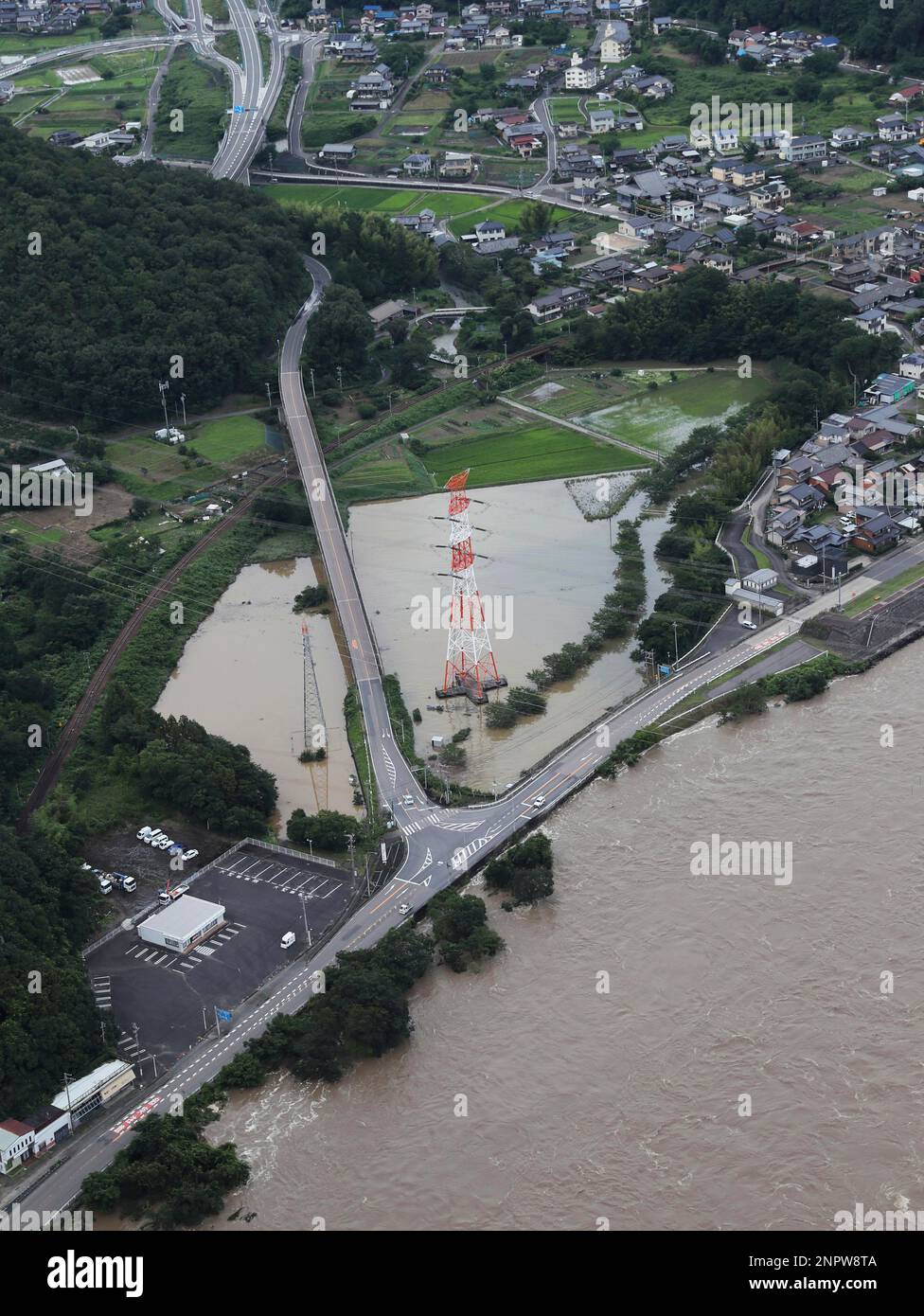 An aerial photo shows a rice field where muddy water flowed from ...