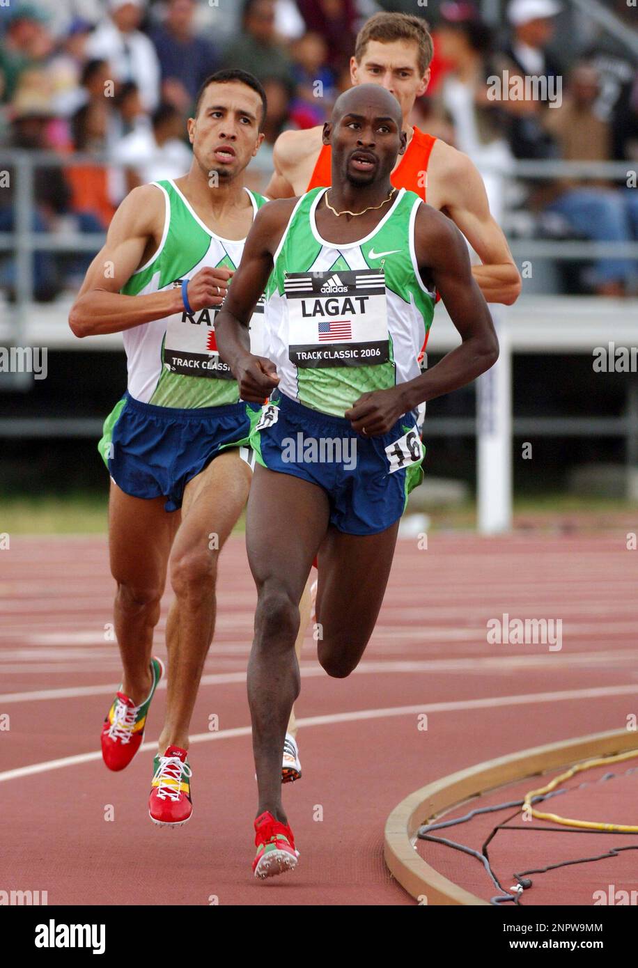 Bernard Lagat leads Rachid Ramzi on the final lap of the 1,500 meters ...
