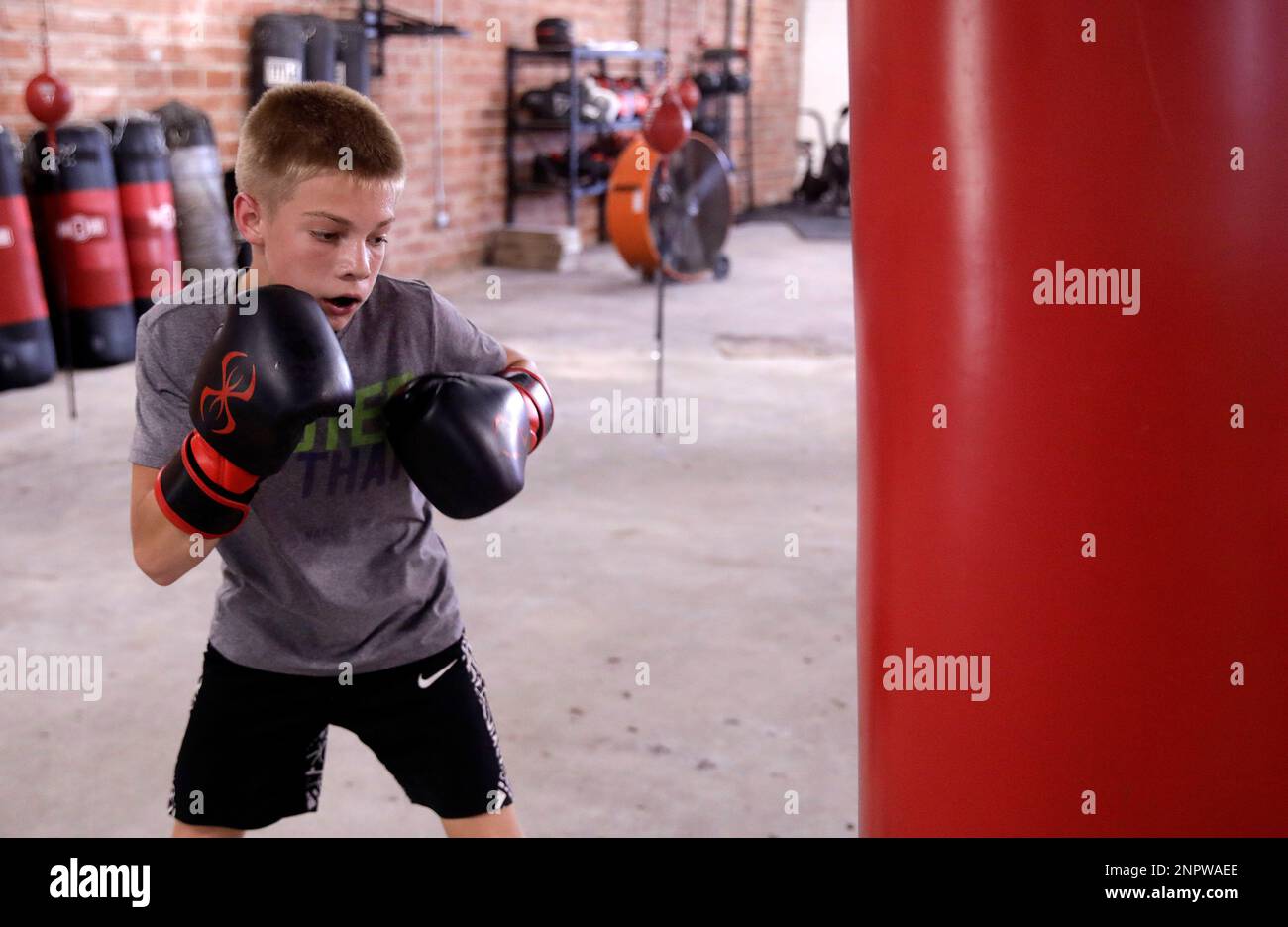 Juan Posada and his son Santiago, 4, spar at The Engine Room boxing gym ...