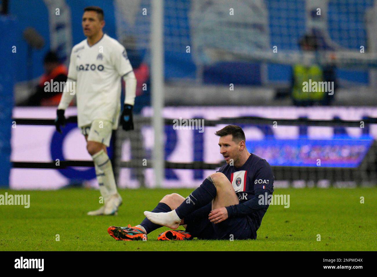 PSG's Lionel Messi reacts after sustaining an injury during the French ...