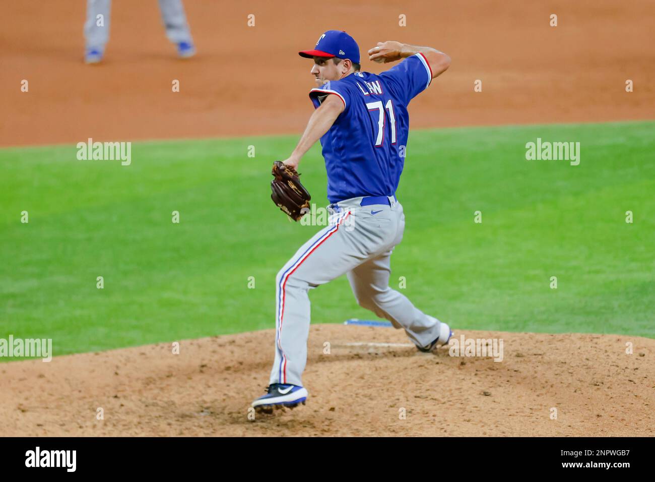 ARLINGTON, TX - JULY 04: Texas Rangers pitcher Derek Law (71) winds up ...