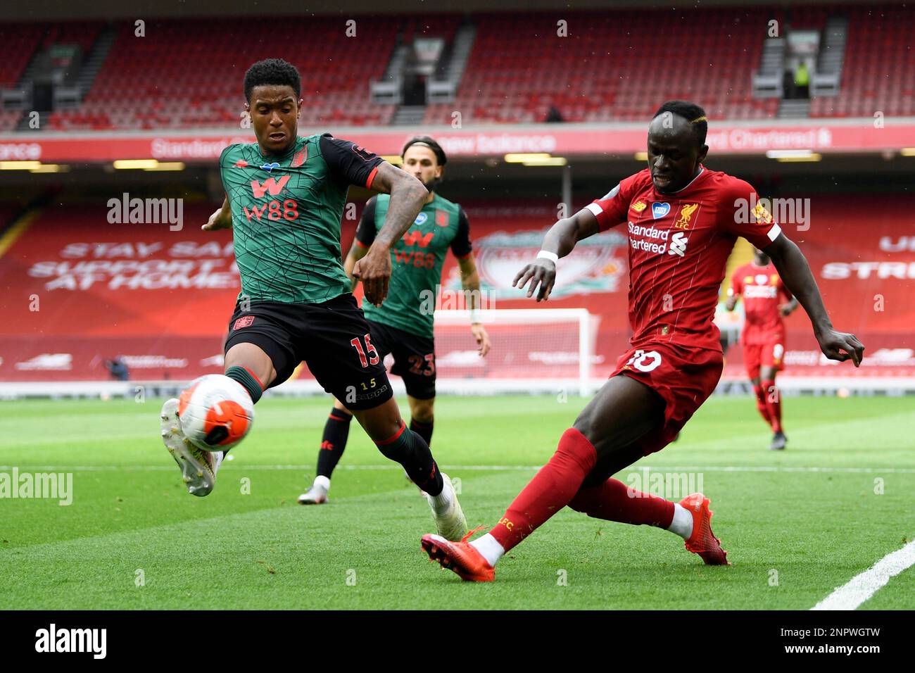Aston Villa's Ezri Konsa tries to block a shot from Liverpool's Sadio ...