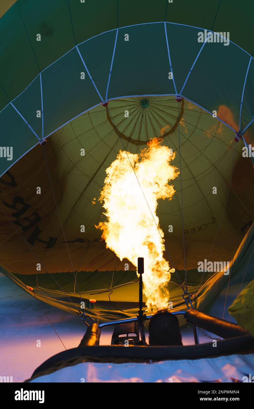 Firing up the burner of a hot air balloon. Taken at 42nd International ...