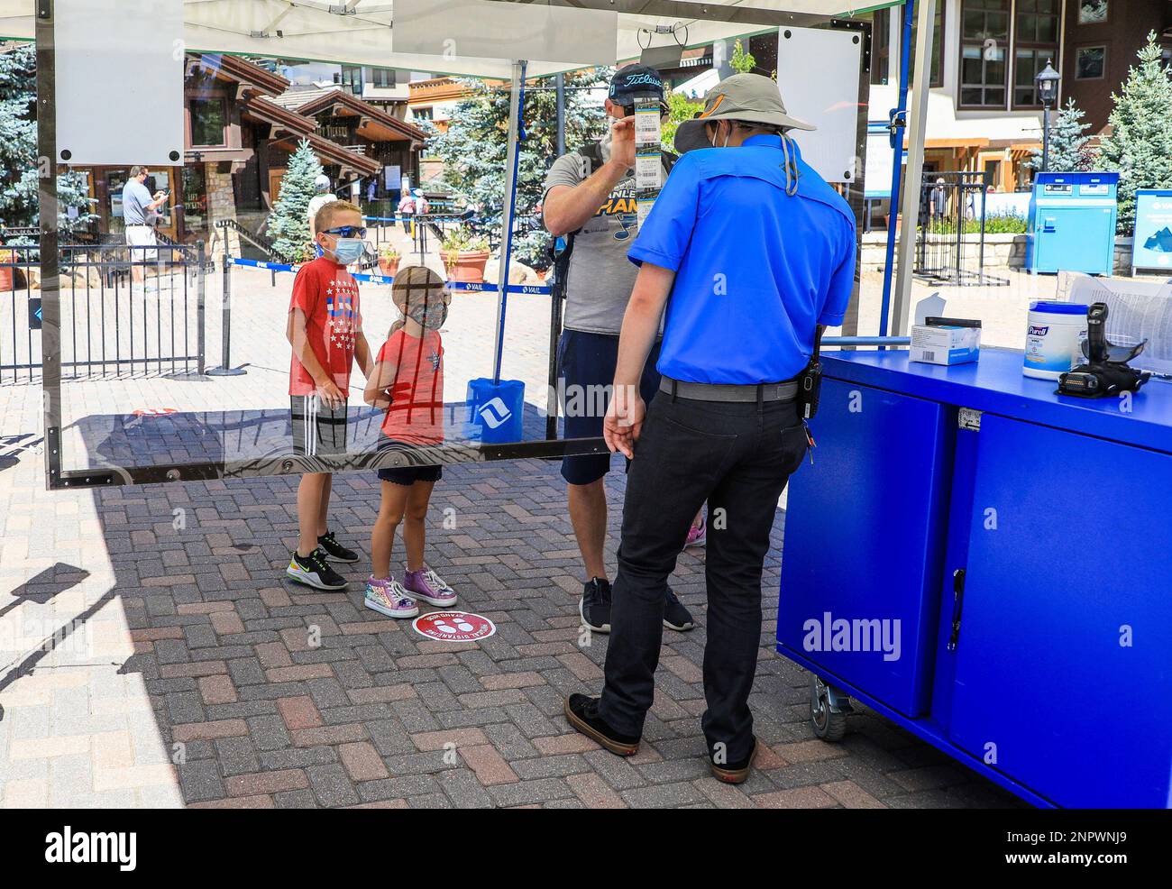 Devin Hauser scans tickets of riders for Gondola One during the ...