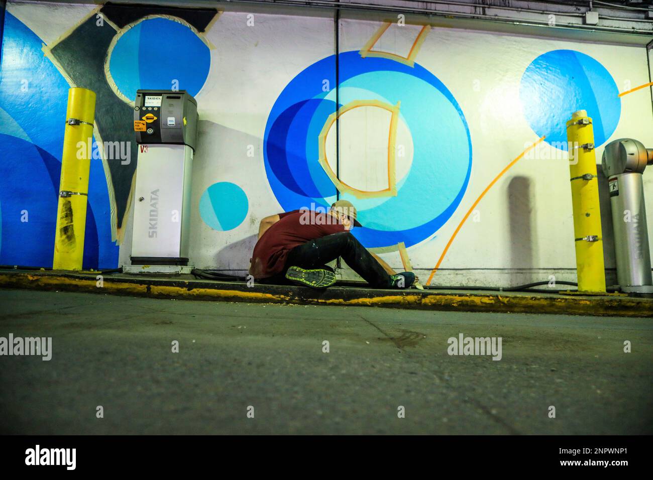 Artist Jason T. Graves tapes the mural through Vail's Art in Public ...