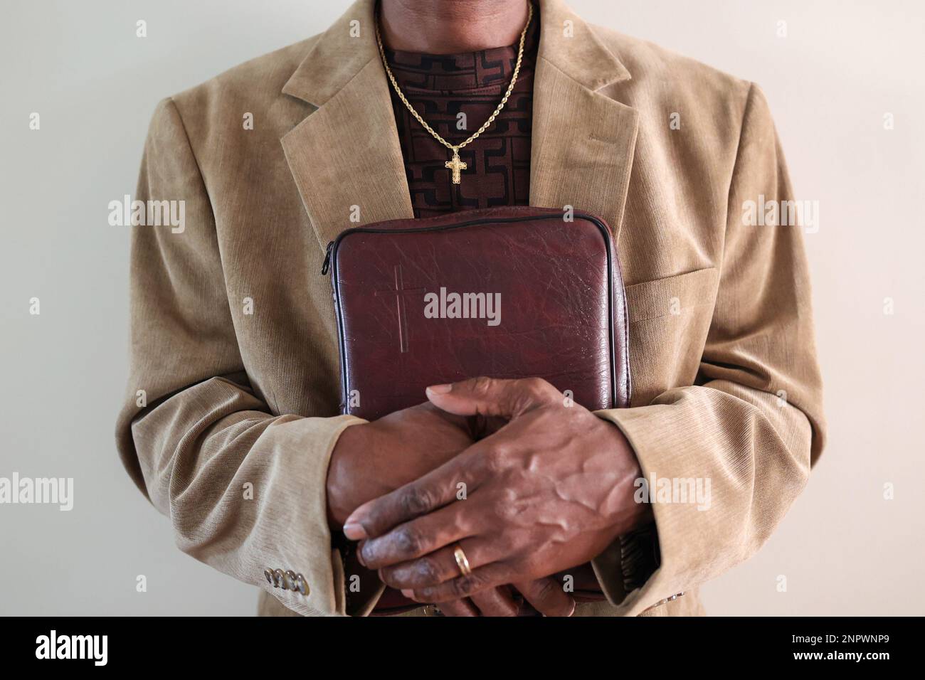 Man holding up bible hi-res stock photography and images - Alamy