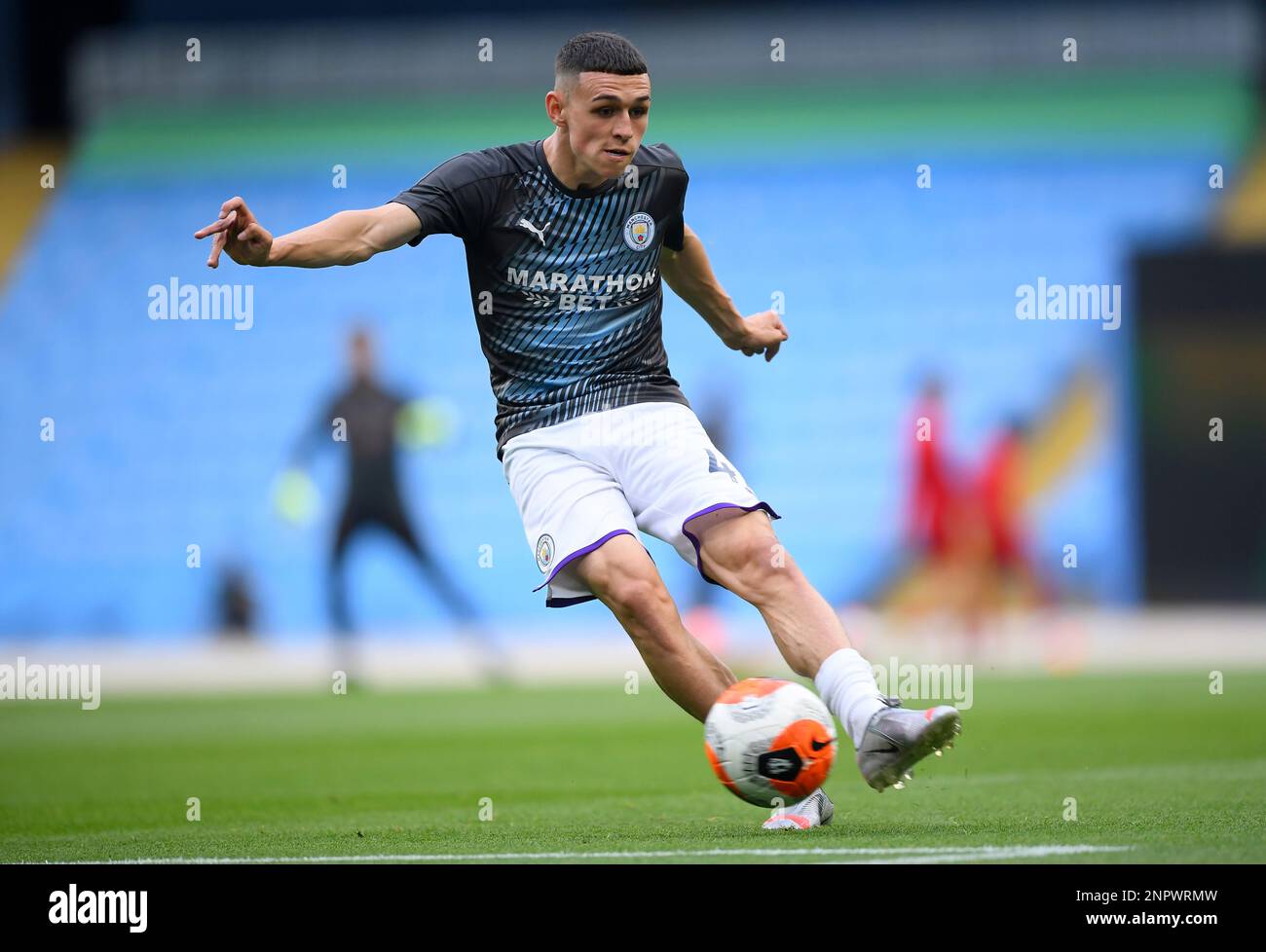 Manchester City's Phil Foden kicks the ball during the warm up ahead of ...