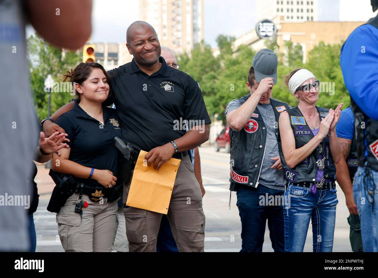 Tulsa Police officers Nereyda Villa and Darrell Ross hug during a vigil ...