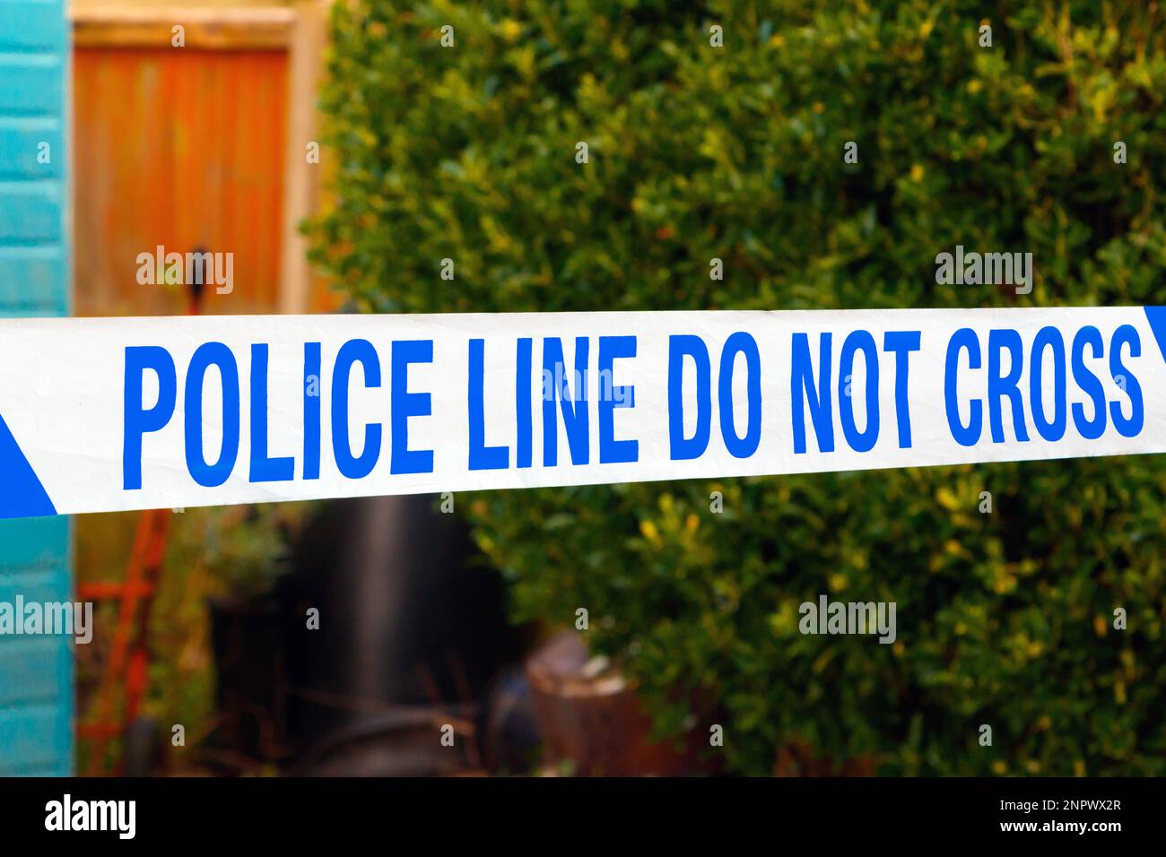 close up of police line do not cross tape at cordon around crime scene ...