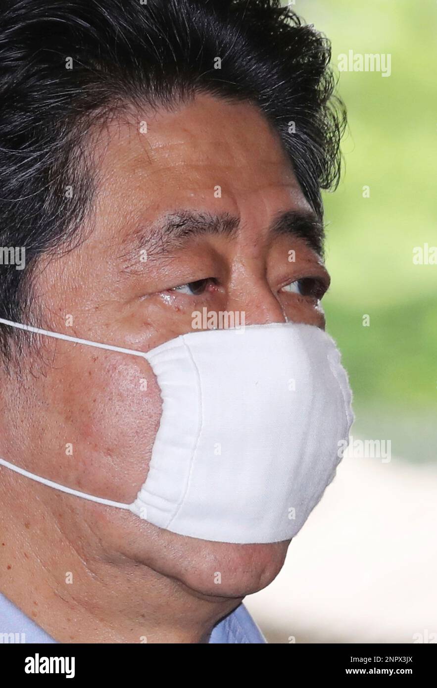 Japan's Prime Minister Shinzo Abe wearing a face mask (abenomask ...