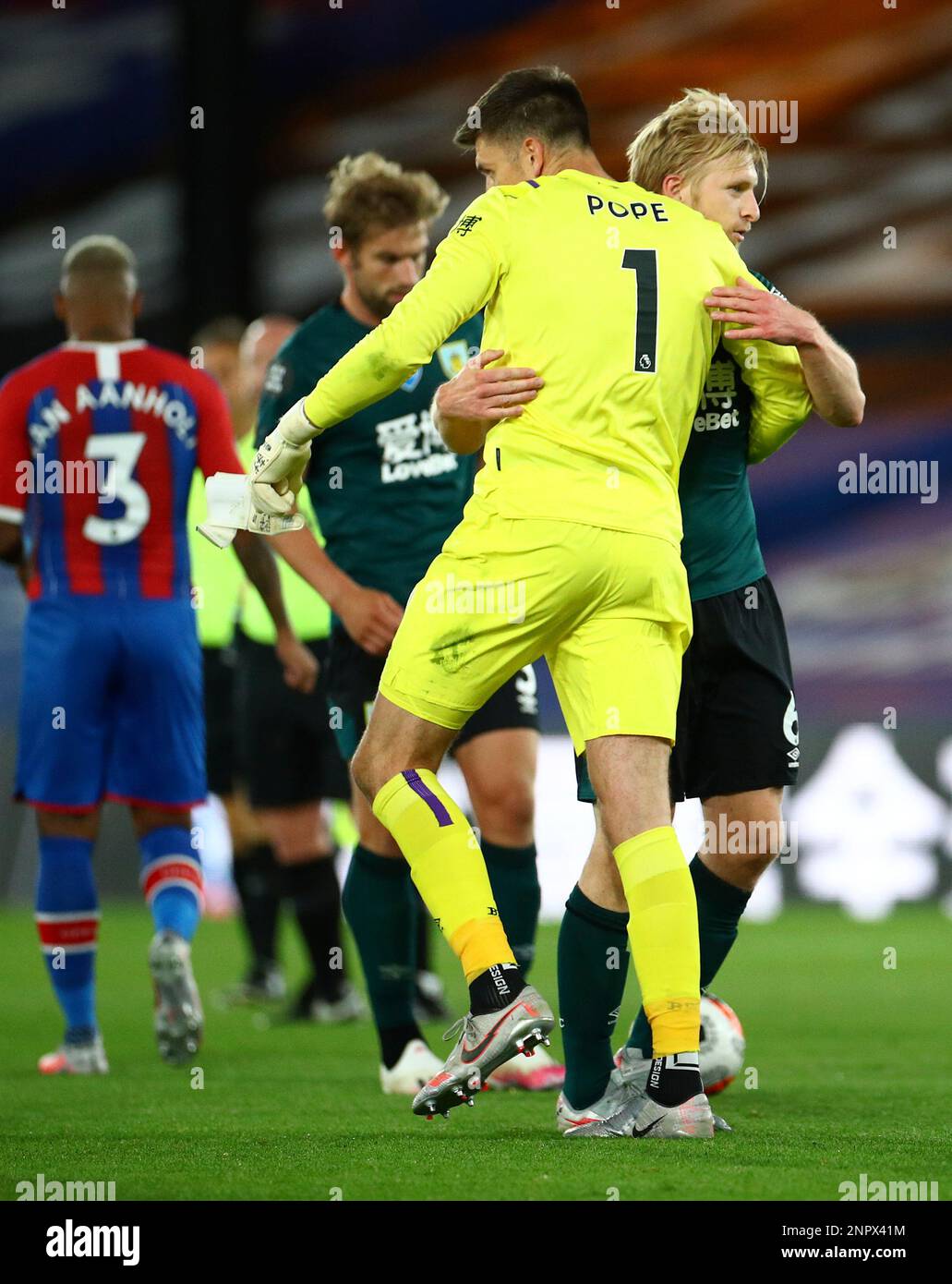 Burnley's goalkeeper Nick Pope and teammate Burnley's Ben Mee embrace ...