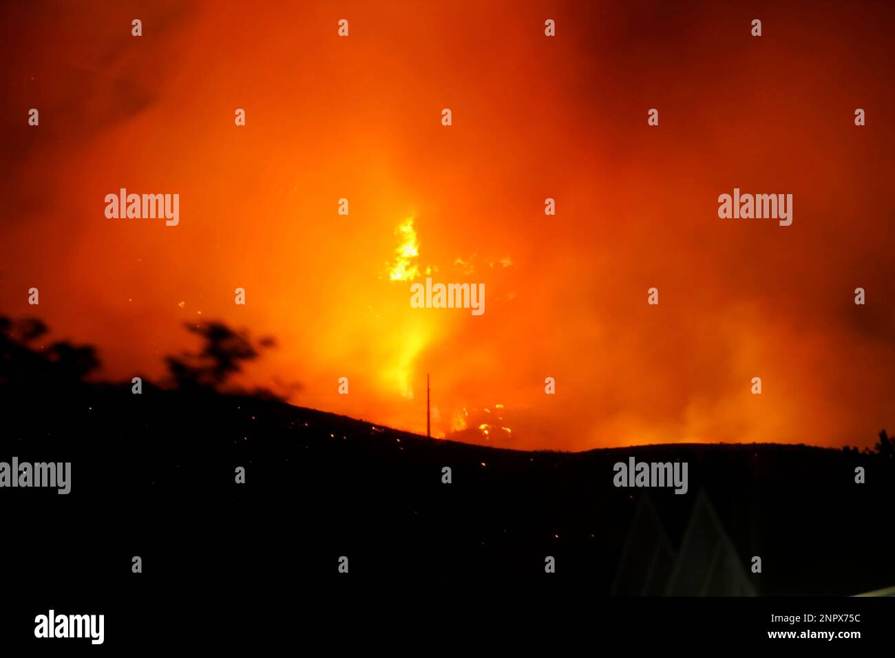 The Traverse Fire burns near homes in Lehi, Utah, Sunday, June 28, 2020 ...
