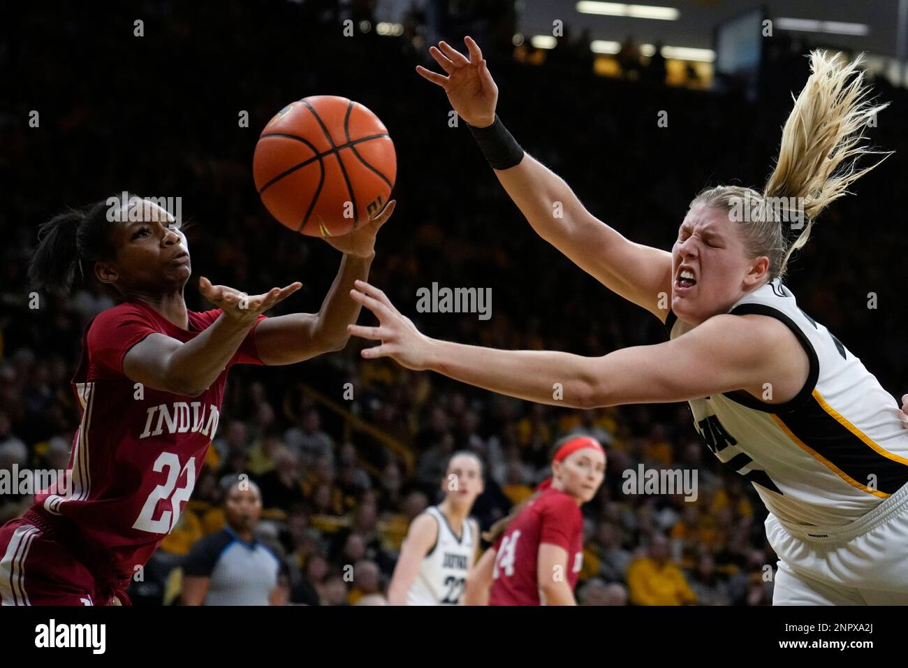 Iowa forward Monika Czinano is fouled by Indiana guard Chloe Moore ...