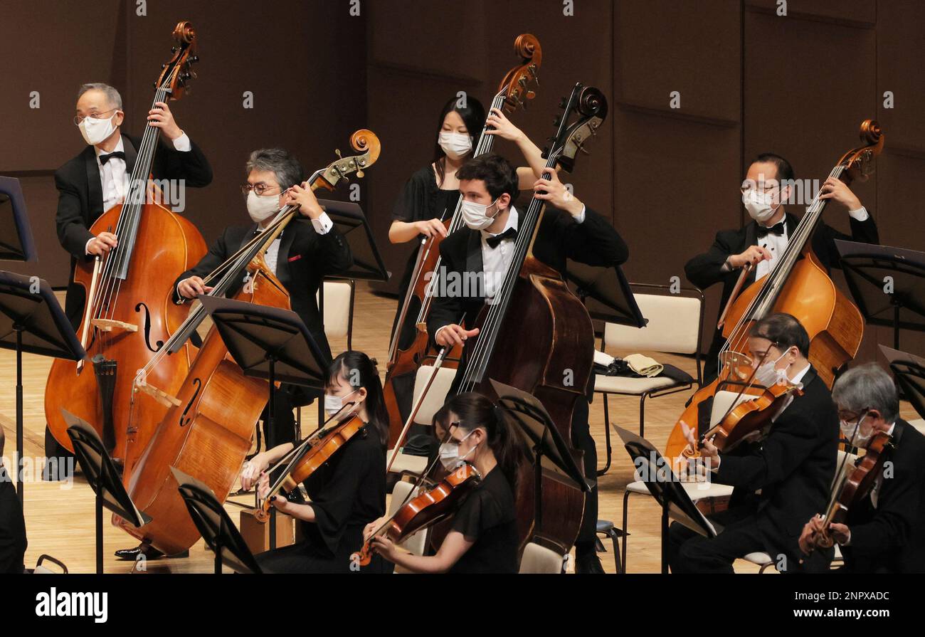 Osaka OhilHarmonic Orchestra members wear masks during their concert in ...