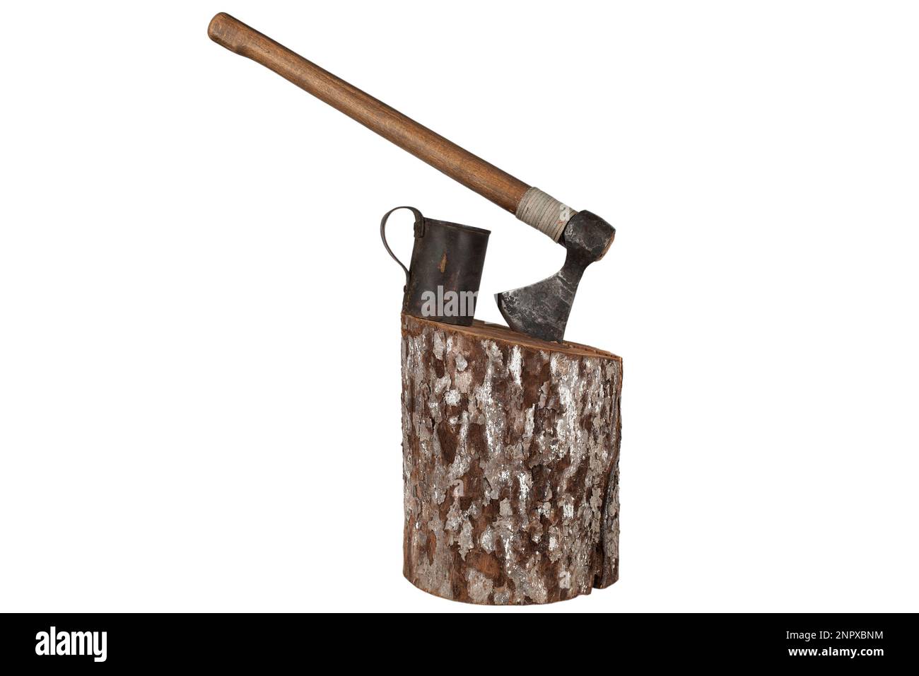antique axe with wooden handle in wood log with brass mug on white ...