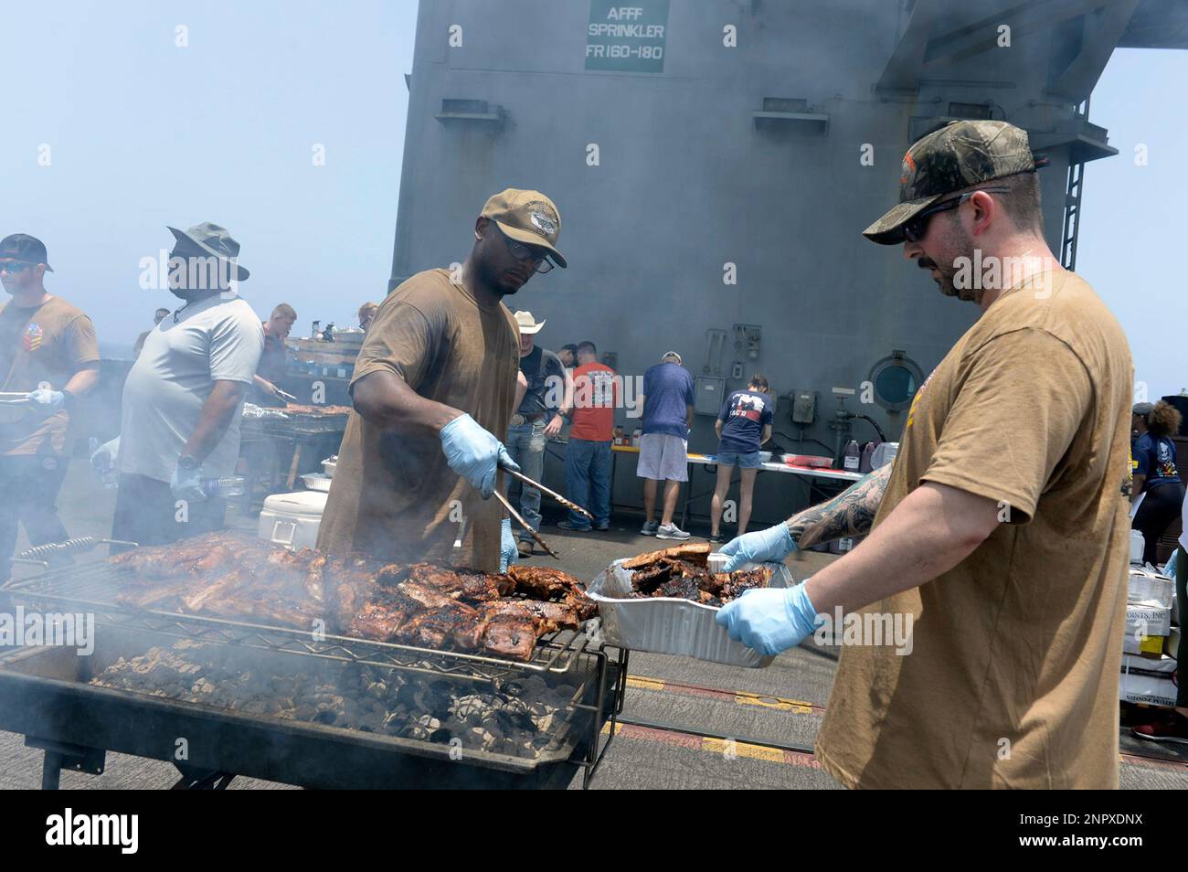 In this June 6, 2020, photo provided by the U.S. Navy, sailors ...