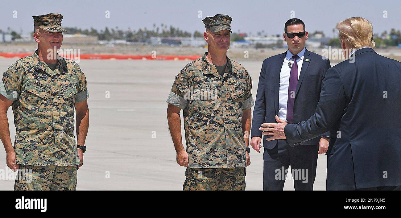 President Donald Trump, right, gets a smile from U.S. Marine Corps Sgt ...