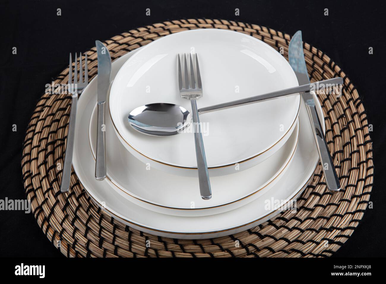 Silver cutlery, porcelain plate, restaurant menu concept. Table set on ...