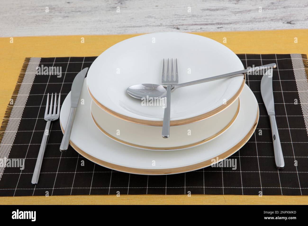 Silver cutlery, porcelain plate, restaurant menu concept. Table set on ...