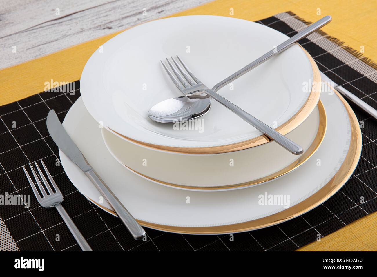 Silver cutlery, porcelain plate, restaurant menu concept. Table set on ...