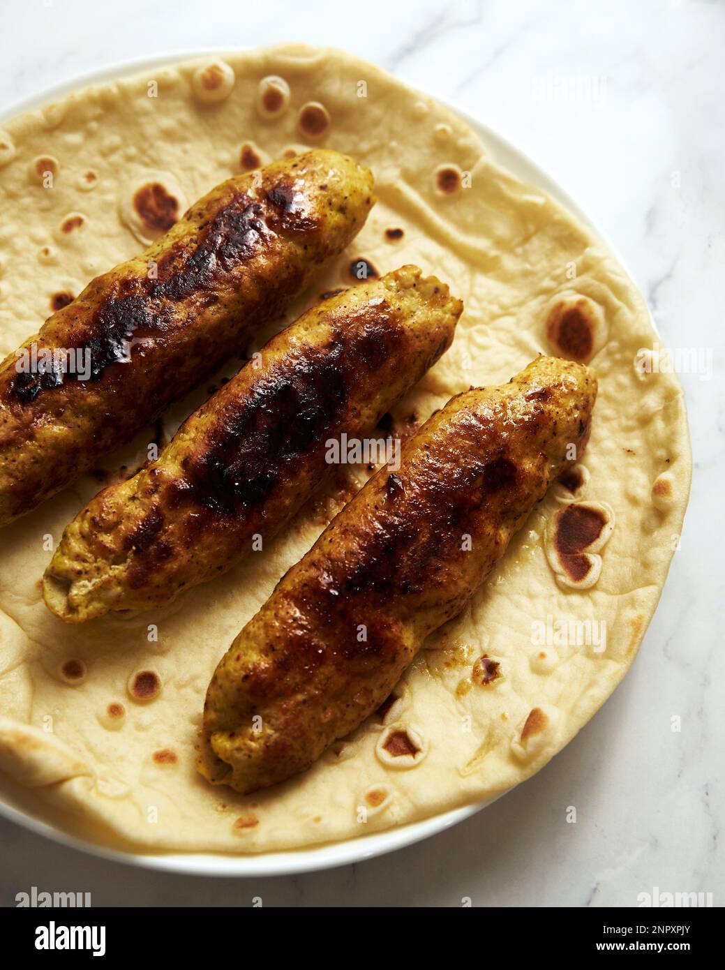 Chichen Persian Koobideh Kebab. Kebab with turmeric, onions, sumac, and ...