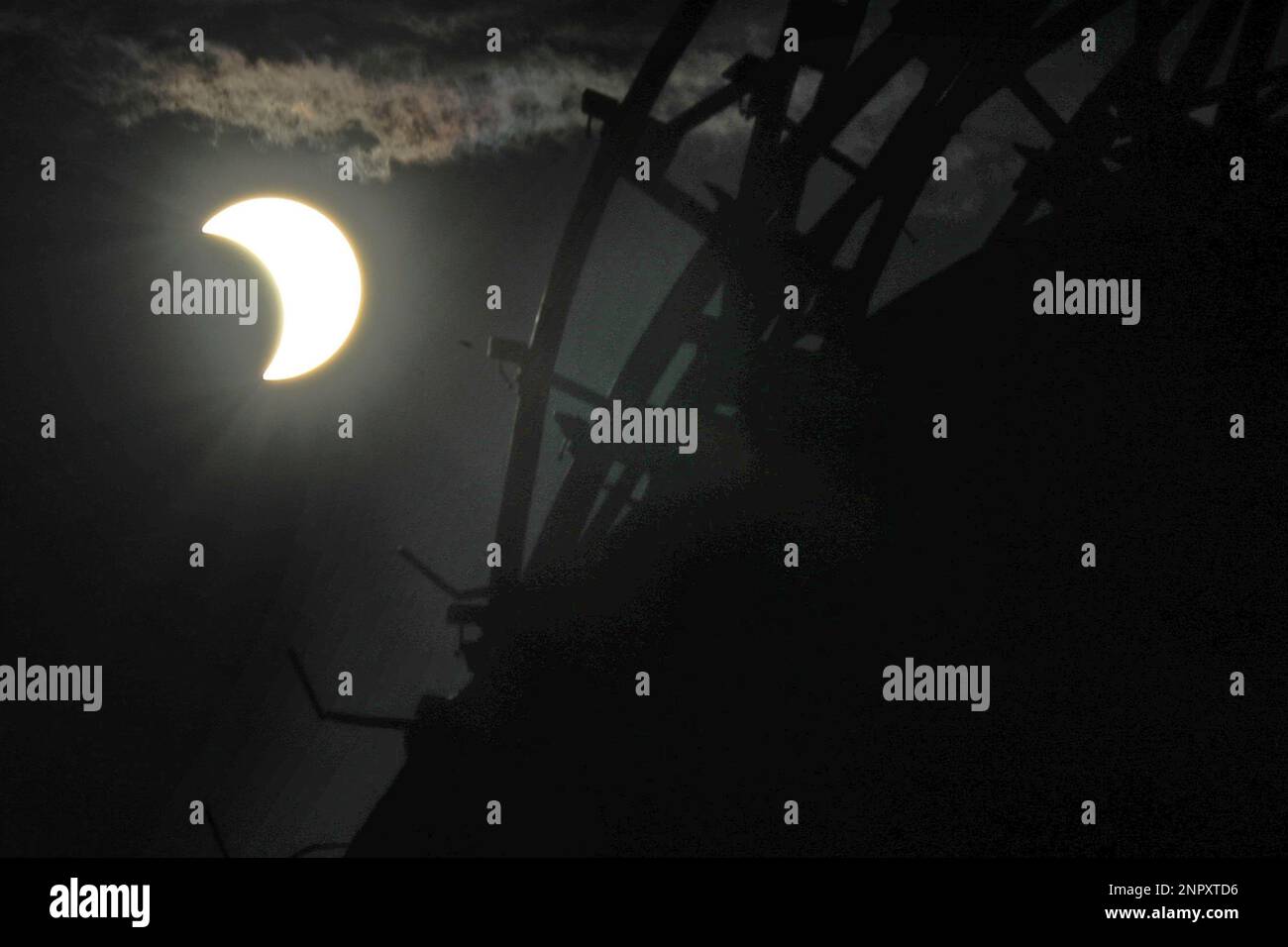 A partial solar eclipse is observed above Atomic Bomb Dome in Hiroshima on June 21, 2020. The ...