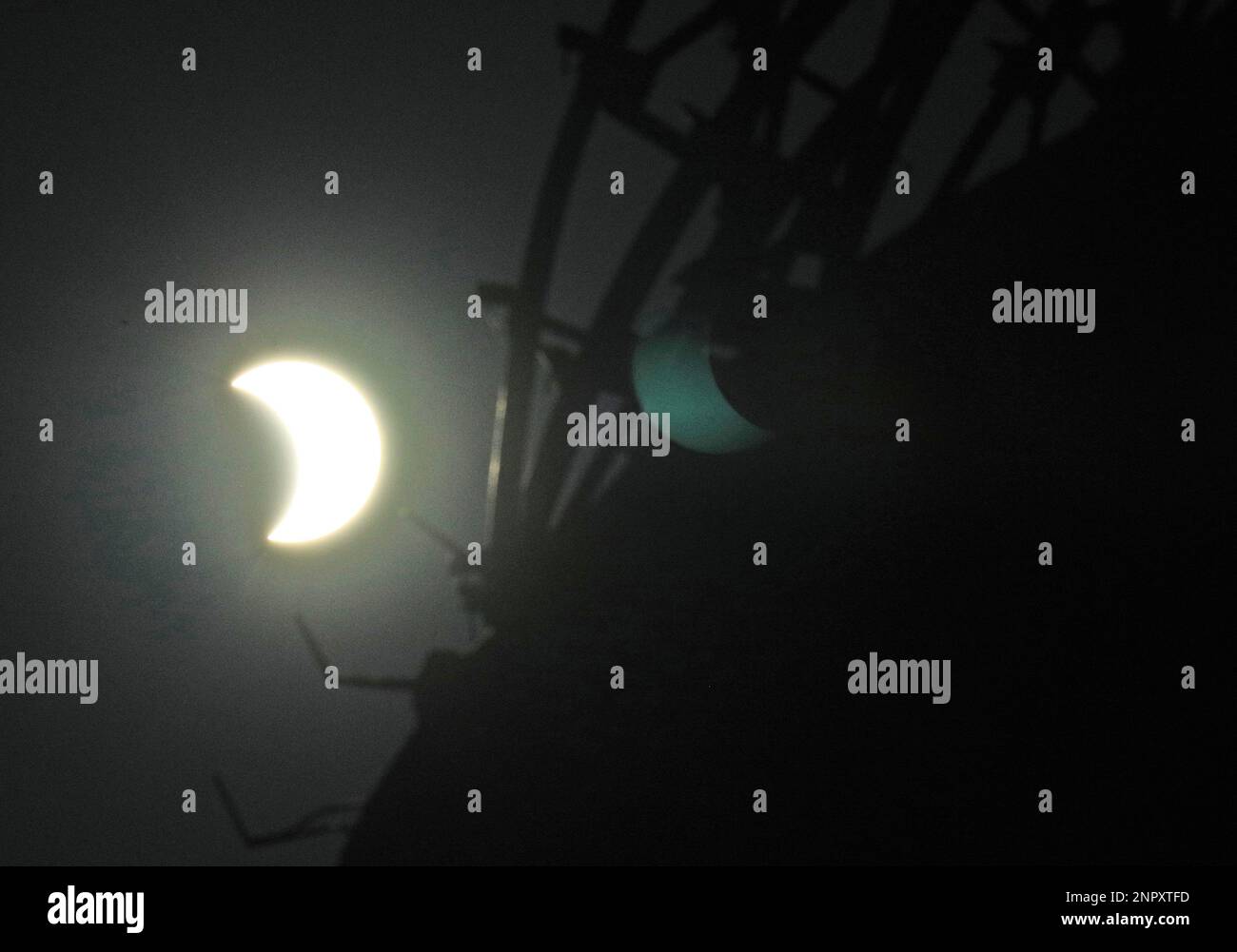 A partial solar eclipse is observed above Atomic Bomb Dome in Hiroshima on June 21, 2020. The ...
