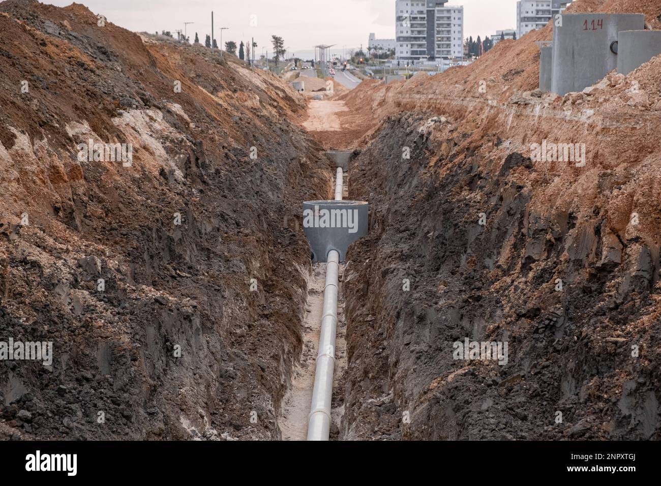 Plumbing line system in city. Deep installation of water pipe and ...