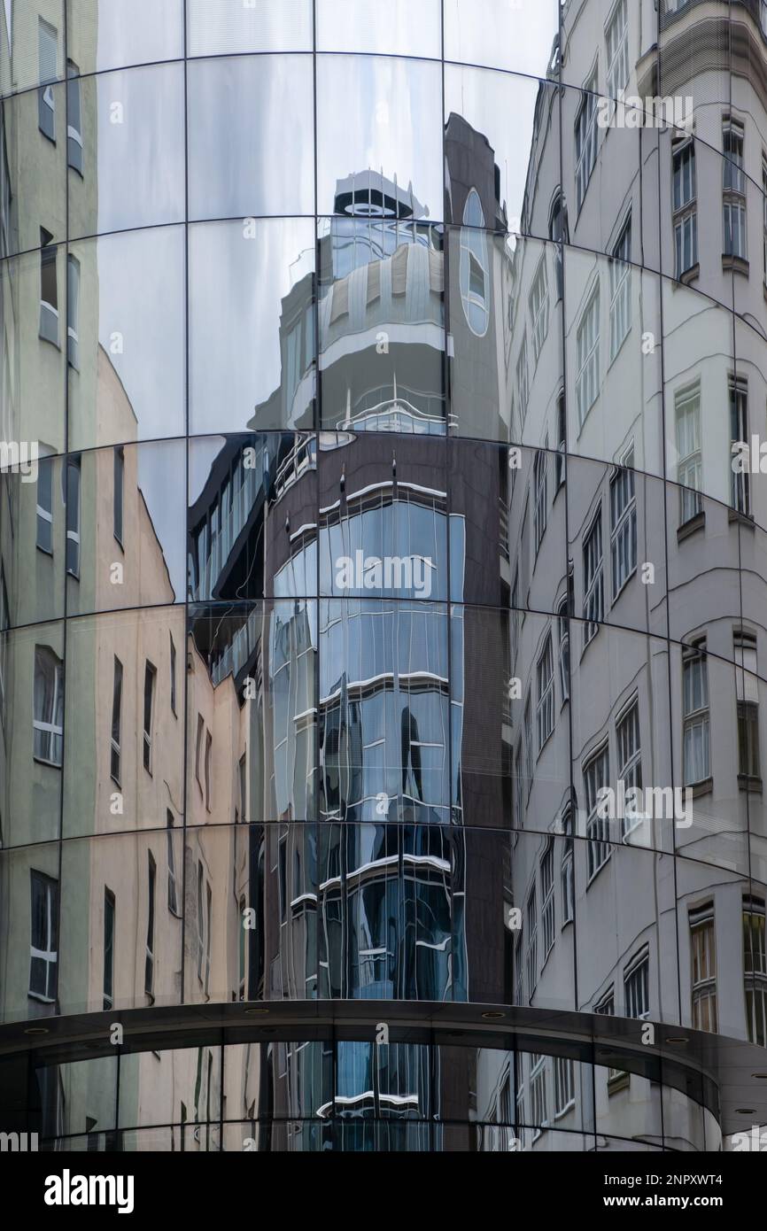 a European architecture reflecting in the mirror glass facade of a ...