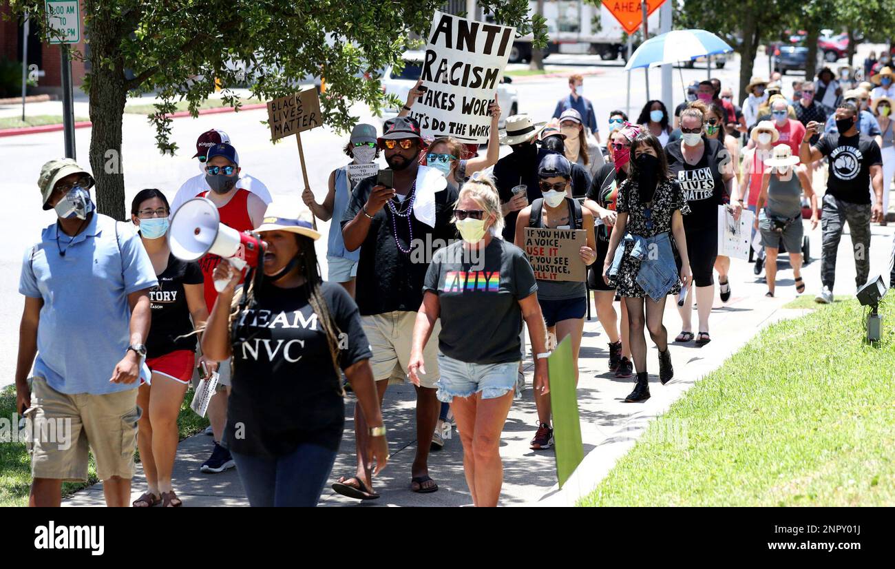 Protestors march from the 1859 Ashton Villa, where a statue of a ...