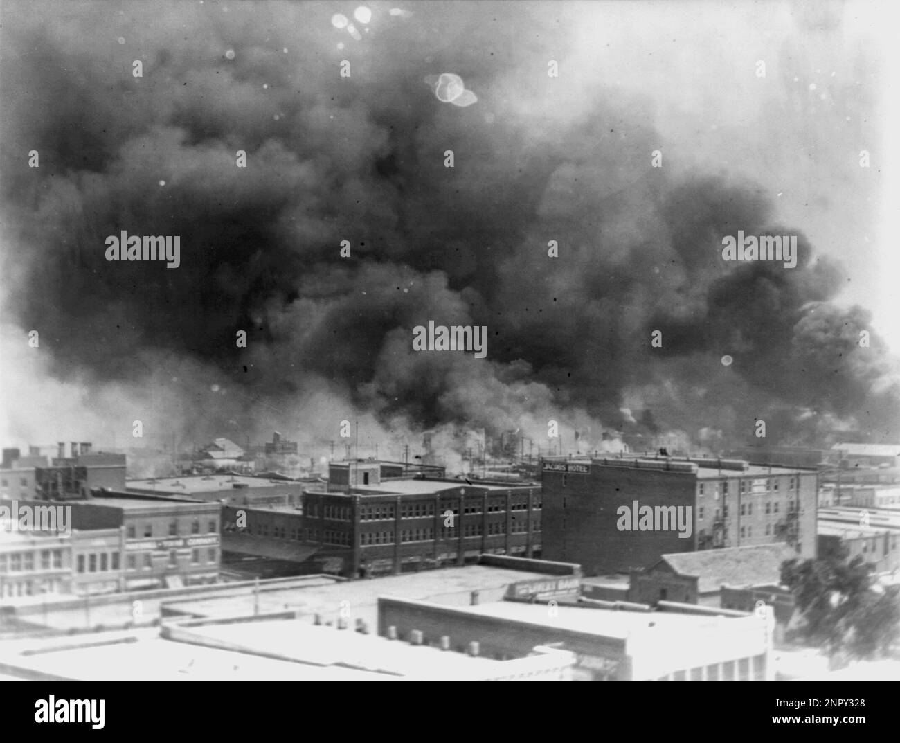 In this 1921 image provided by the Library of Congress, smoke billows ...