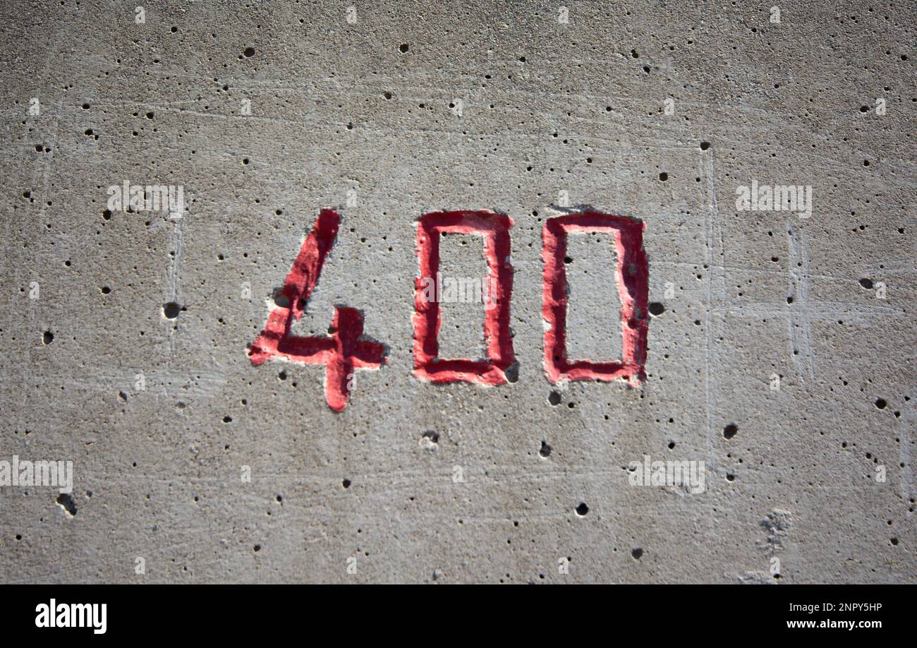 the number 400 carved into a concrete wall in red Stock Photo - Alamy