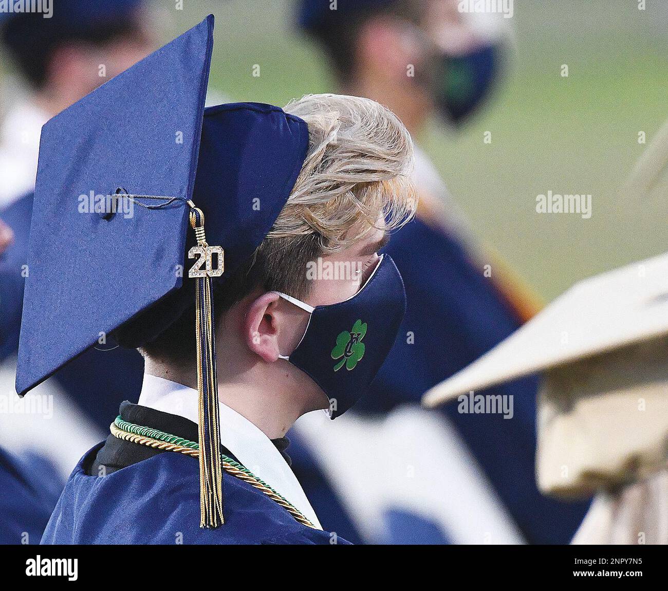 A Yuma Catholic High School graduating senior watches their graduation ...