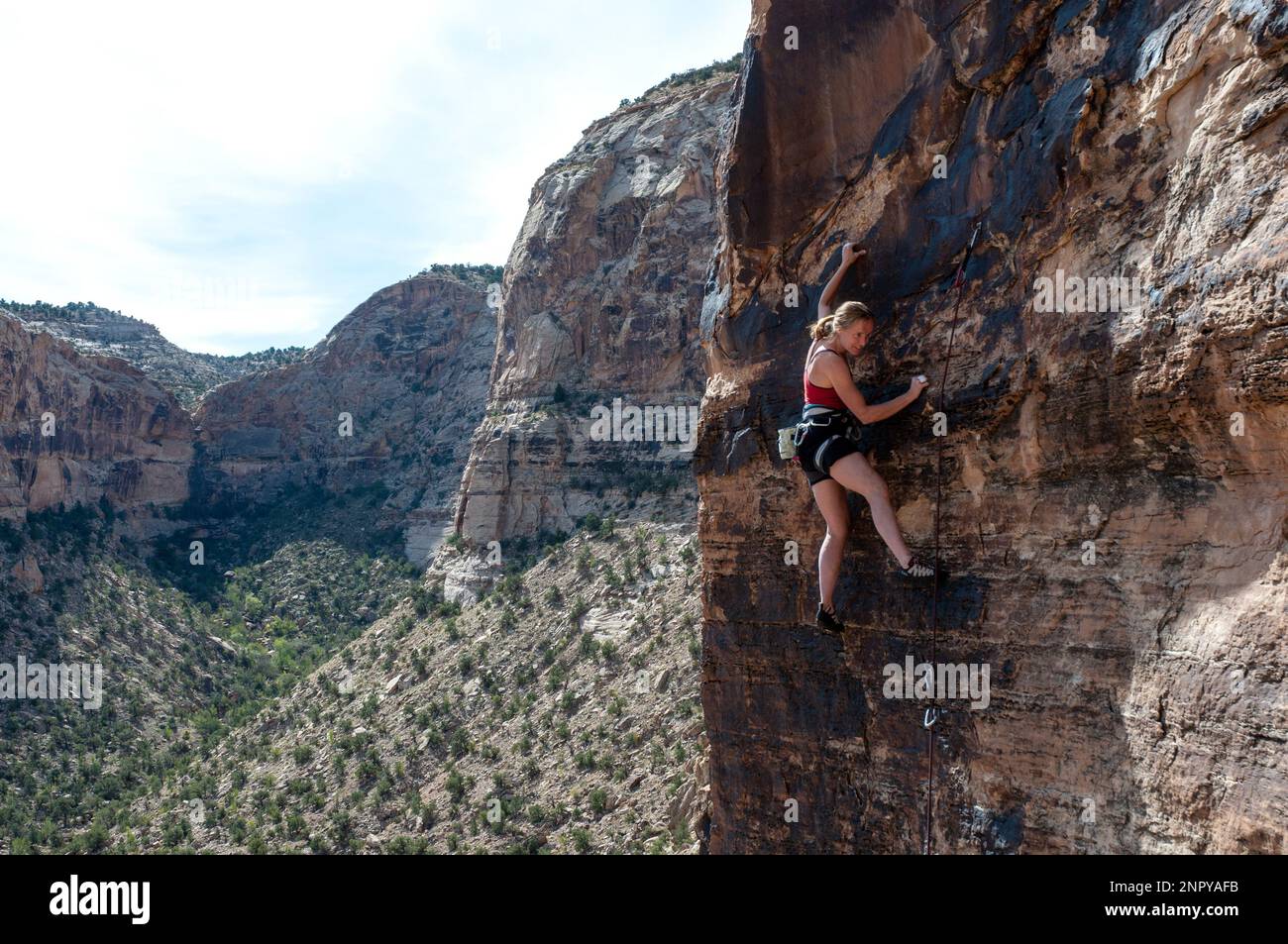 Single female rock climbing in central Utah. USA Stock Photo - Alamy