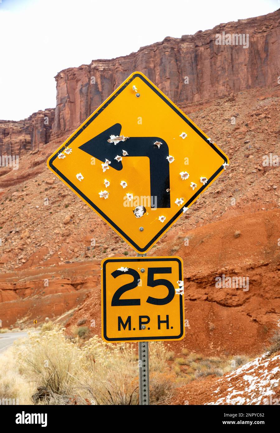 Left turn caution sign in Grand County, Utah Stock Photo - Alamy