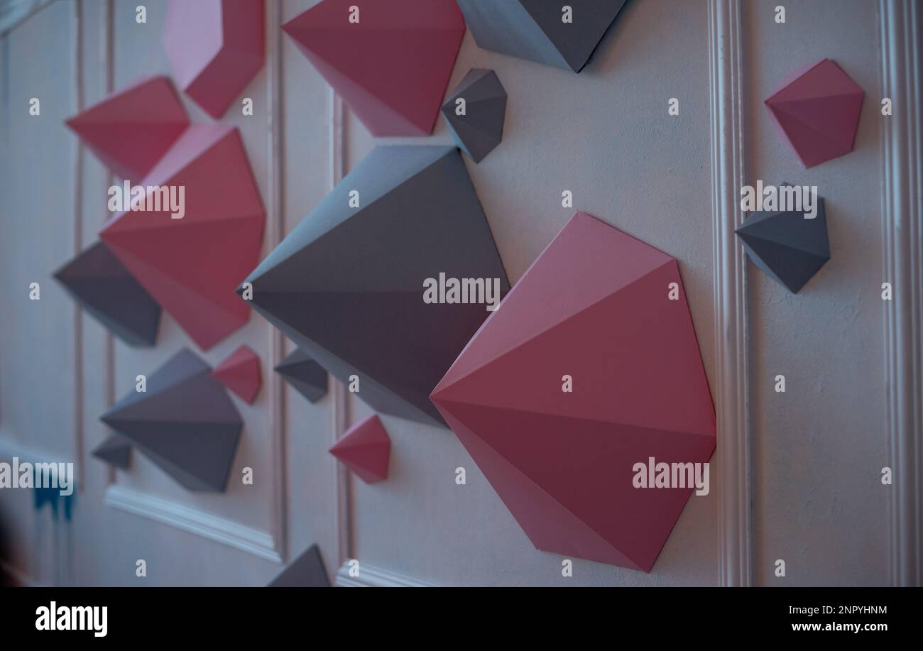 Abstract background of paper polygons of gray, pink, different shapes ...