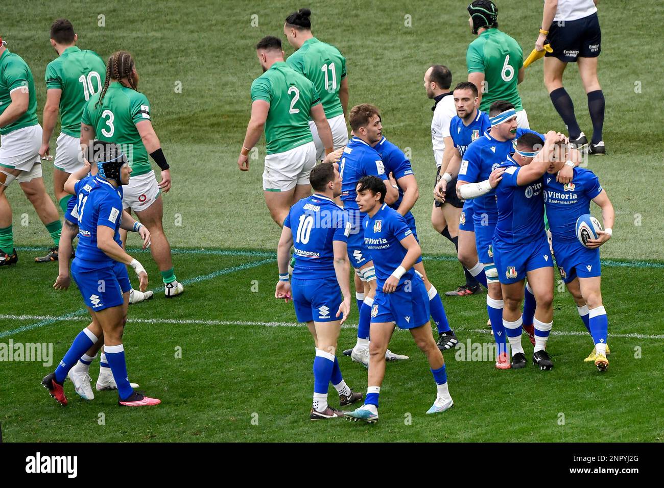 Stephen Varney of Italy celebrates with team mates after scoring a try ...