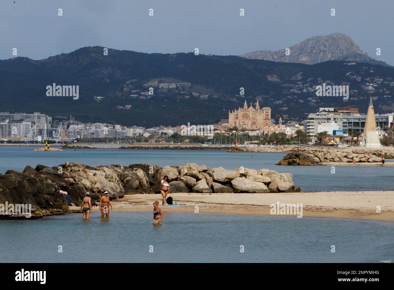 In this May 25, 2020 photo, people visit the beach in Palma de Mallorca ...