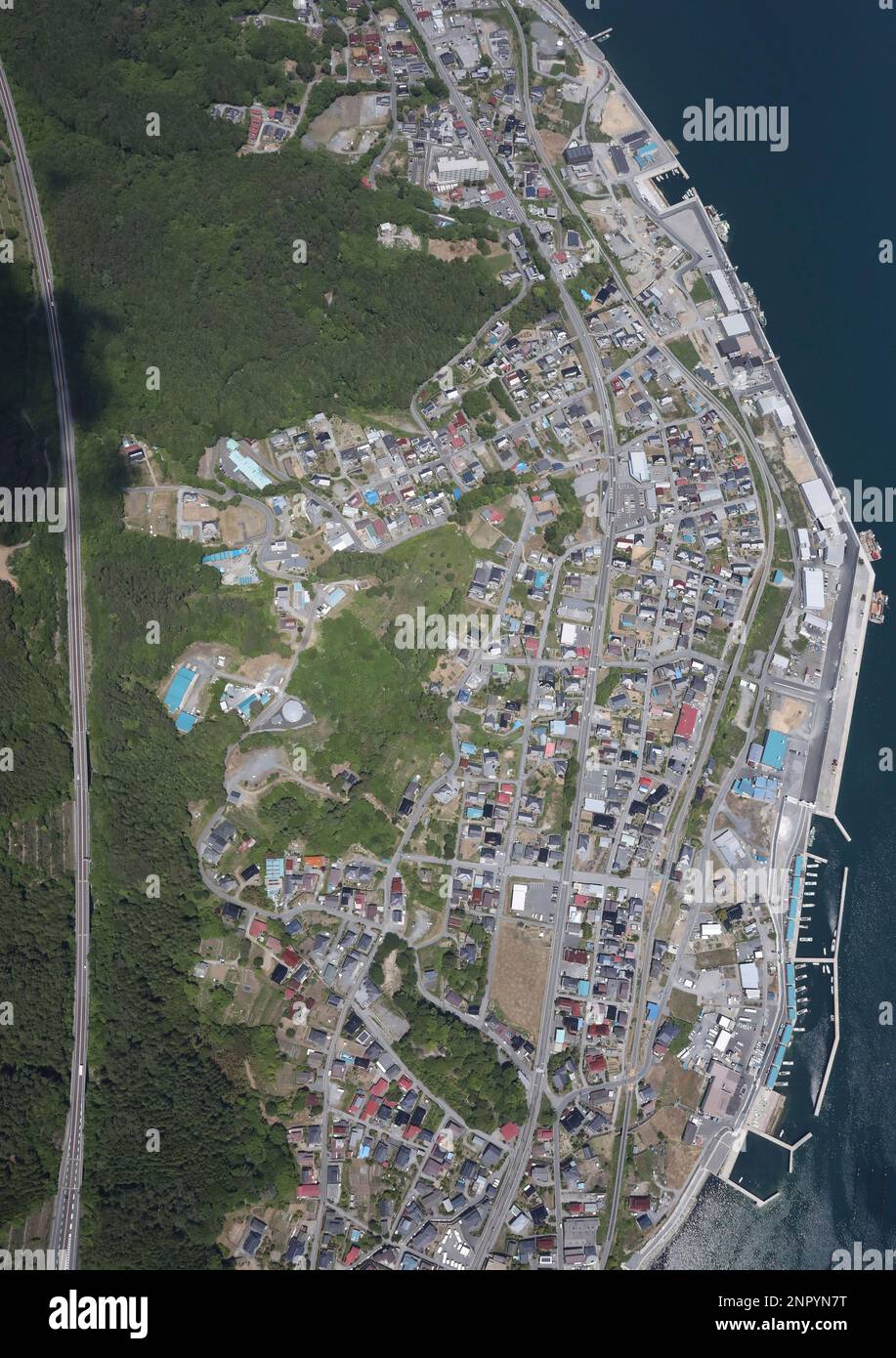 An aerial photo shows Reconstruction Road (L) in Ofunato City, Iwate ...