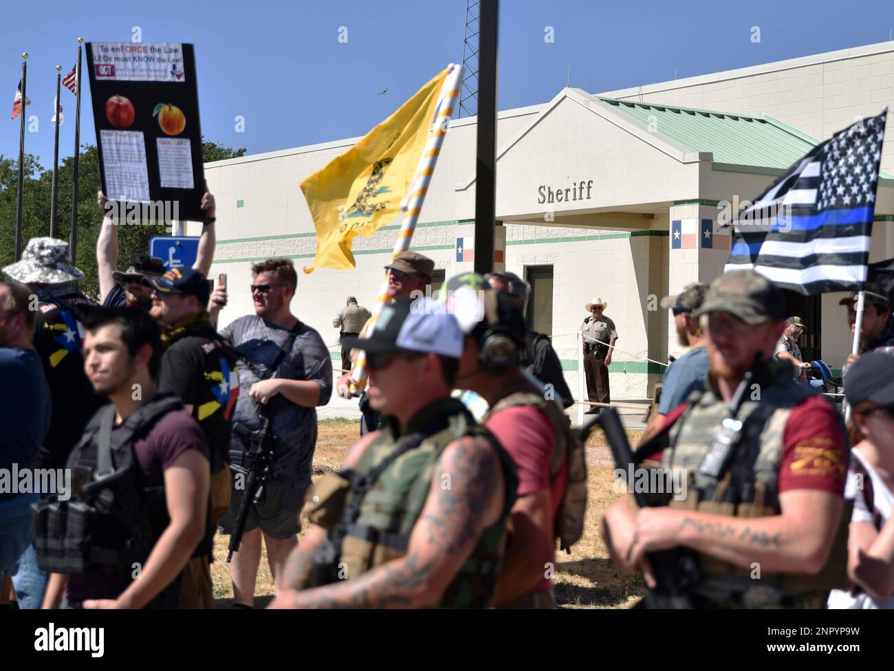Open Carry Texas protesters line up for a group photo outside of the ...