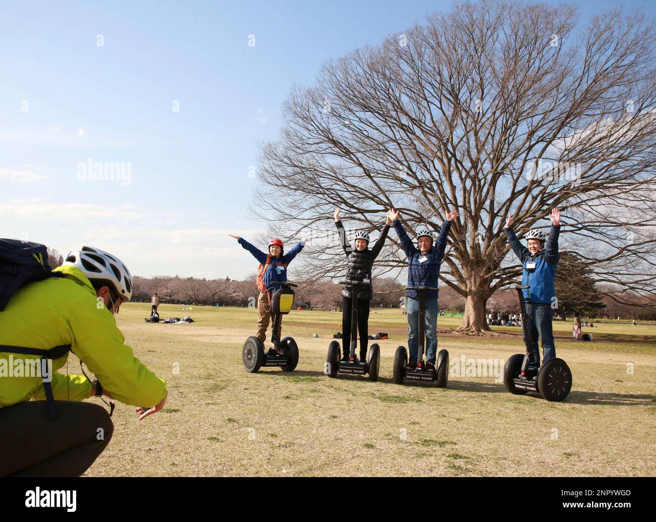 People enjoy driving a Segway at Showa Kinen Park in Tachikawa, Tokyo ...