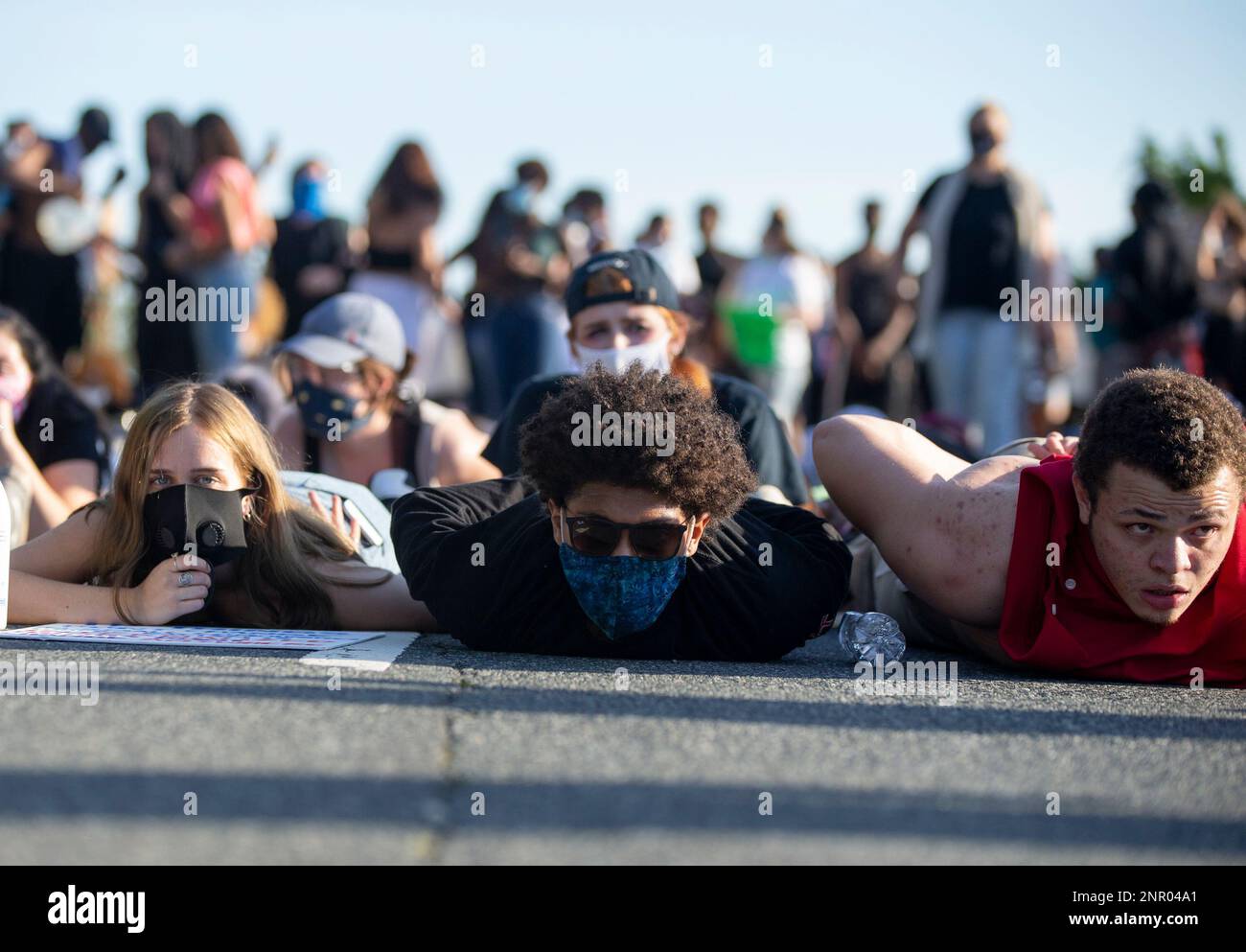 Protesters lie face downward on the Falmouth Bridge, blocking Jefferson ...