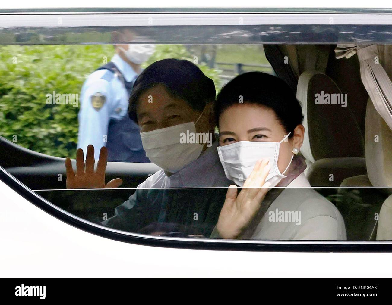 Japan's Emperor Naruhito and Empress Masako wearing masks enter ...