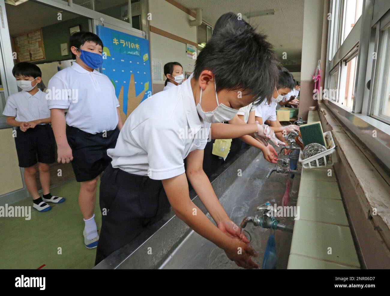 Students wash their hands with care at Joto Elementary School in ...