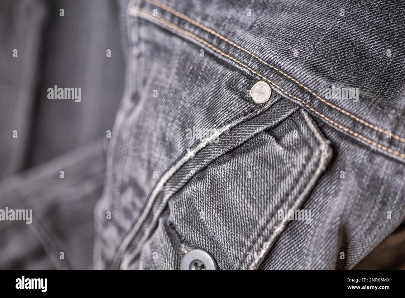 A denium gray jean pocket closeup, banner with space for text. View of ...