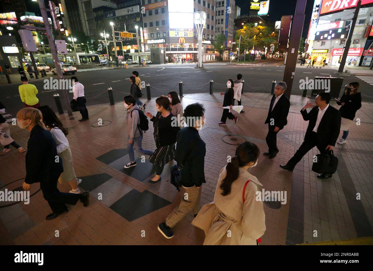 People wearing masks walk in Sapporo, Hokkaido Prefecture on May 29 ...