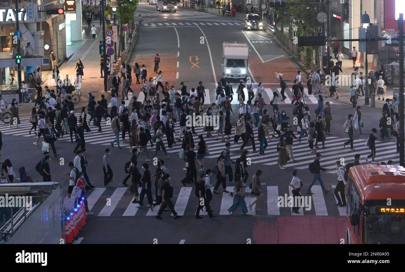 People wearing masks are seen at Shibuya Scramble Crossing in Tokyo on ...