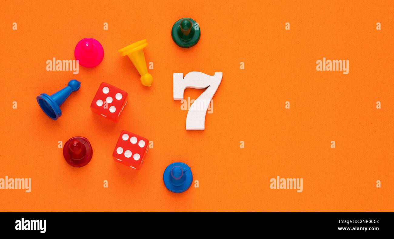 Number 7 with dice and board game pieces - Orange eva rubber background ...