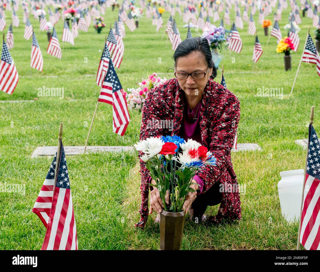 May 25, 2020, Bear, DE, USA: May 25, 2020: Patricia Nguyen lays flowers ...