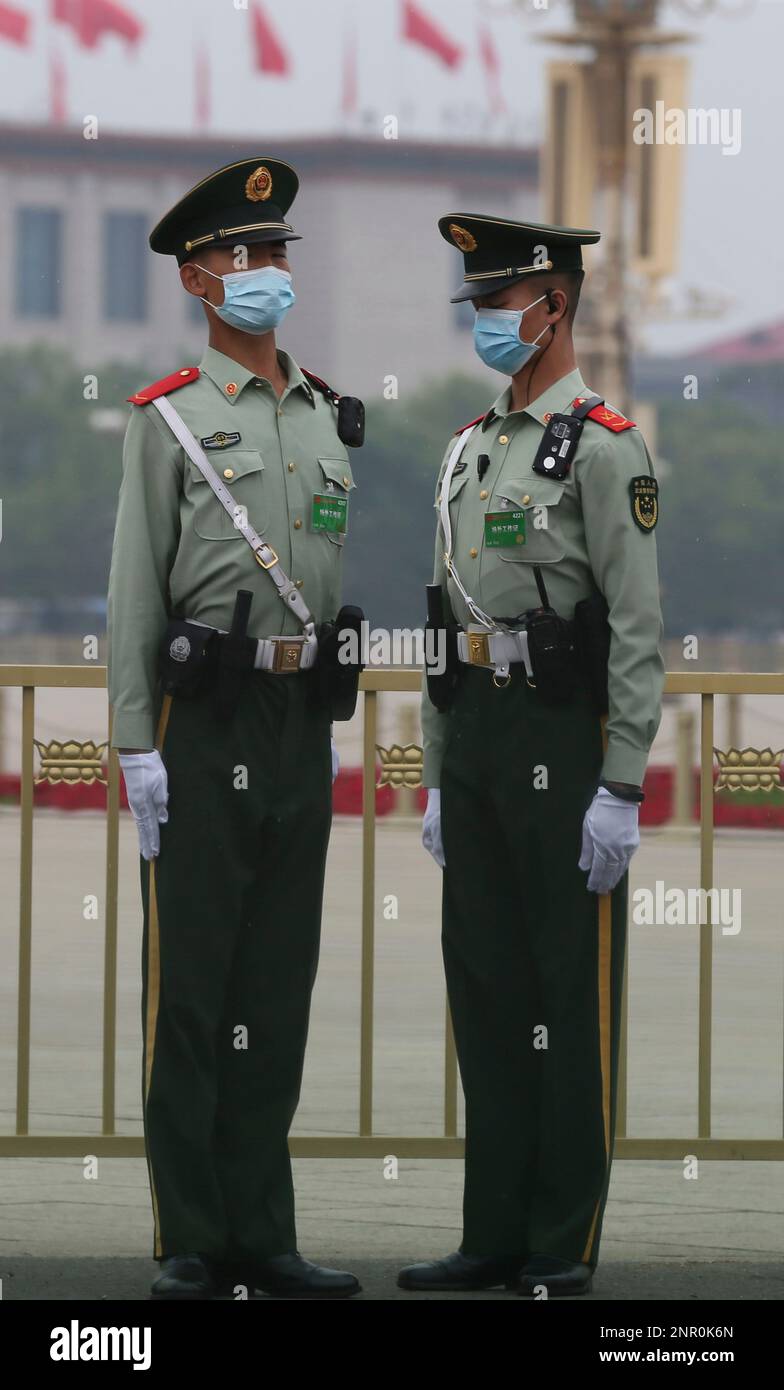 People's Armed Police officers guard near the Great Hall of the People ...